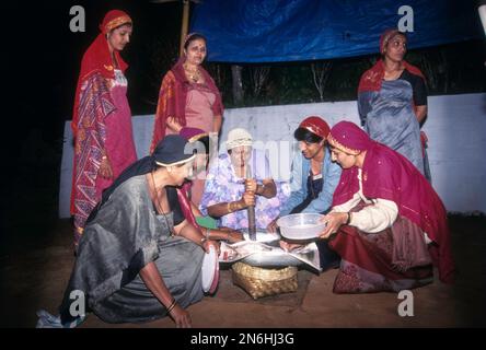 Kodava women making rice ball, Kadamputtu, during Huthri festival ...
