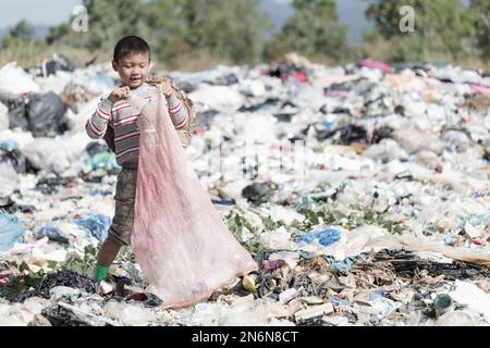 Poor children collect garbage for sale because of poverty, Junk recycle ...
