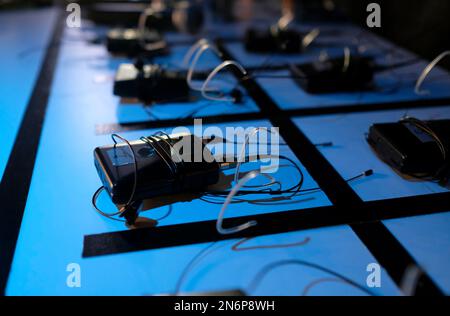 Clip-on microphones ready in the backstage area of a TV production ...