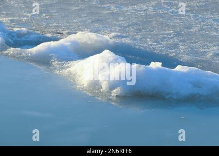 A snowy morning at the end of March on the main road junction in ...