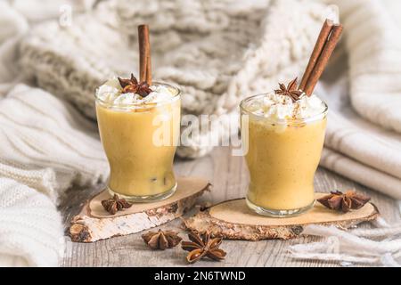 Two glasses of eggnogg with whipped cream and cinnamon. Auld Man's milk ...