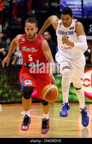 Puerto Rico's Jose Barea, front, who play for Minnesota's Timberwolves ...