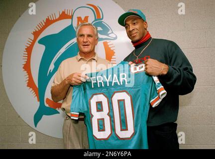 Miami Dolphins' Irving Fryar, left, out races Atlanta Falcons' Bruce ...
