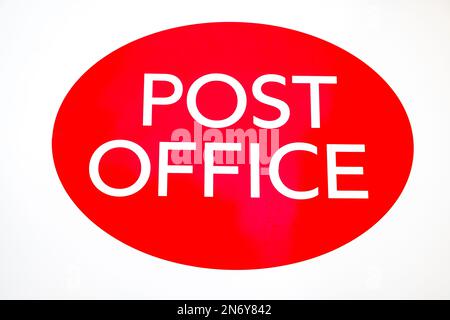 Close up of post office sign signs signage exterior England UK United ...