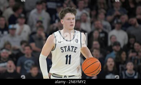 Utah State guard Max Shulga, right, passes the ball past San Diego ...