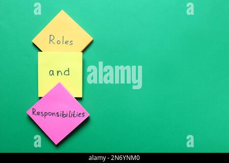 Roles and Responsibilities! on the sticky notes with bokeh background ...