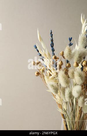 Dried bunny tail grass and lavender with wheat stalks in white buckets ...