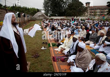 Kenyan Muslims listen to the Imam as he delivers sermon during the Eid ...