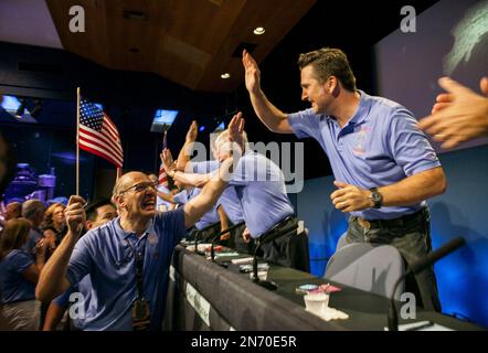 Adam Steltzner, right, celebrates a successful landing inside the ...