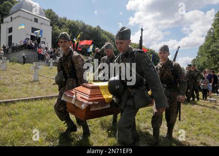 Ukrainians dressed in the SS Galychyna Division uniform act during ...