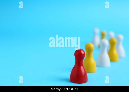Red playing piece with following group on light blue background. Roles ...