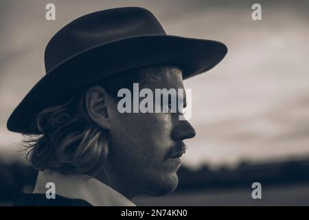 Man with cowboy hat, portrait, sideways Stock Photo - Alamy