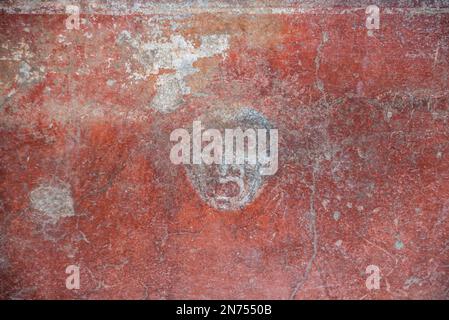 Scenic mask in a fresco of an ancient Roman villa in Pompeii, Southern ...