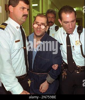 FILE - This July 16, 1992 file photo shows Rodney King being escorted ...