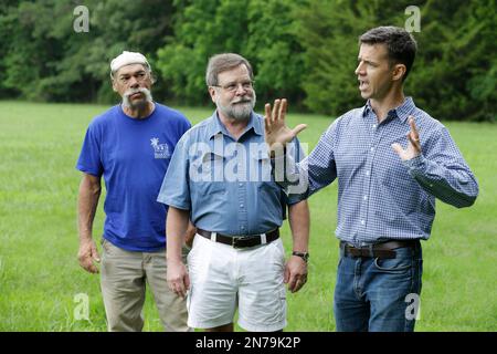 Martin Gallivan, College of William professor, center, gestures as ...