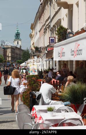 A Busy street with restaurants in Warsaw, Poland Stock Photo - Alamy