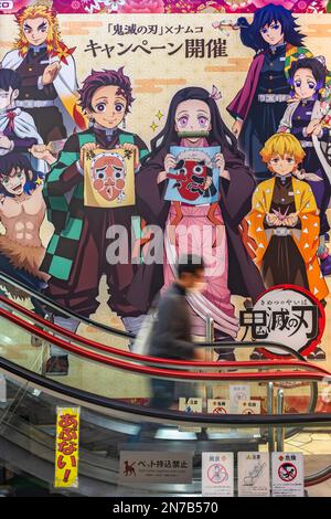 Demon Slayer: Kimetsu no Yaiba Manga series. Books on a shelf Stock ...