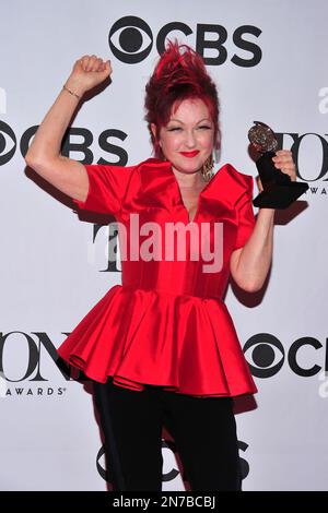 Cyndi Lauper poses with her award in the press room at the 67th Annual ...