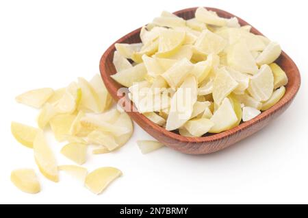 Sliced amla fruits closeup over white background Stock Photo - Alamy