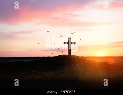 Christian cross on hill outdoors at sunrise. Resurrection of Jesus ...