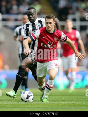 Newcastle United's Cheick Tiote, left, vies for the ball with ...