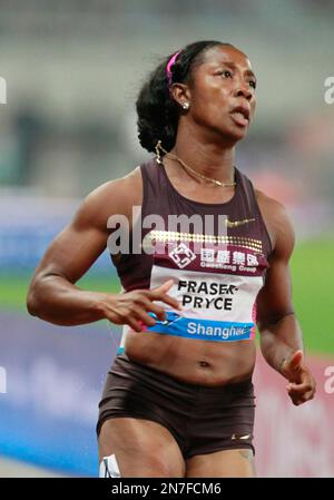 Jamaica's Shelly-Ann Fraser-Pryce, left, crosses the finish line to win ...