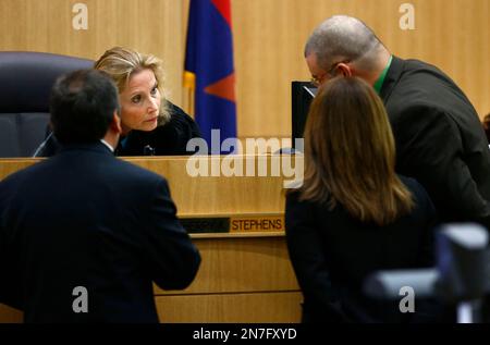 Defense attorneys Kirk Nurmi, right, and Jennifer Willmott listen to ...