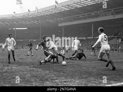 Leeds United goalkeeper Gary Sprake (r) slides out to meet West Ham ...