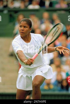 Steffi Graf stretches to reach a shot from Pam Shriver, during their ...