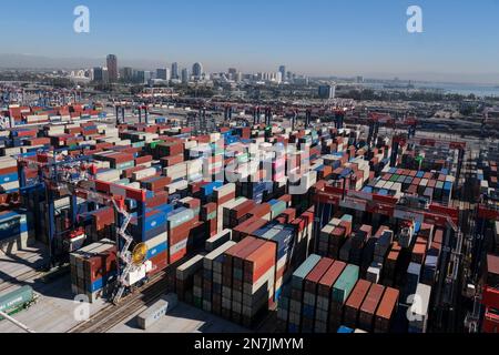 Stacked shipping containers wait to move by Automated Staking Cranes ...