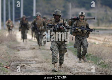 U.S. Marines from the 3rd Marine Expeditionary Brigade on their Light ...
