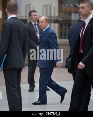 Russian President Vladimir Putin with bodyguards at the summit of the ...