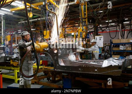 Workers at the assembly line of the new Dacia Sandero car at the Somaca ...
