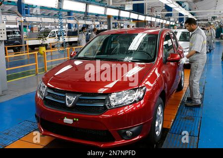 Workers at the assembly line of the new Dacia Sandero car at the Somaca ...