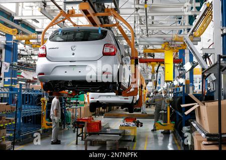 Workers at the assembly line of the new Dacia Sandero car at the Somaca ...