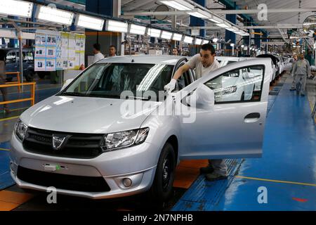 Workers at the assembly line of the new Dacia Sandero car at the Somaca ...