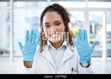 forensic 's hand in black glove writing on evidence bag and seal by red ...