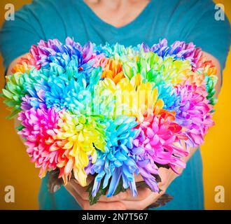 Turquoise painted colors heart on light background Stock Photo - Alamy