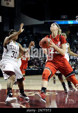 Nebraska's Emily Cady (23) goes for a rebound in front of South Dakota ...