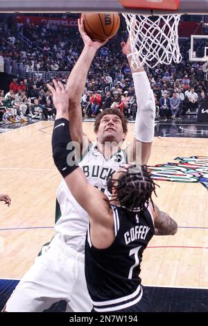 Milwaukee Bucks center Brook Lopez, right, goes up for a shot against ...