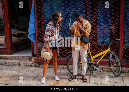 Young multiethnic couple having a bike ride in nature Stock Photo - Alamy