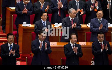 Delegates clap while Chinese Communist Party chief and incoming ...
