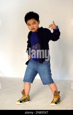 Hwang Min-woo, also known as a Little PSY, poses for the media at a ...