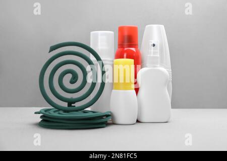 Set of different insect repellents on grey background Stock Photo - Alamy