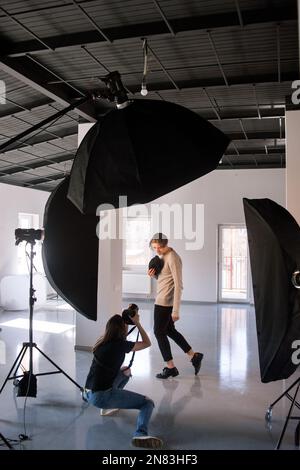 Photographer and model during studio session Stock Photo - Alamy