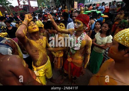 Myanmar Hindu devotees pray as they wait to walk on burning embers ...