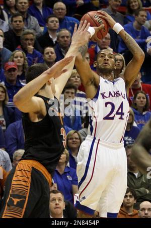 Kansas' Travis Releford (24) shoots as Texas A&M's Elston Turner (31 ...