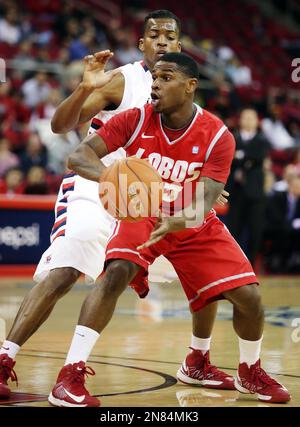 New Mexico's Jamal Fenton (13) drives the lane against Boise State ...
