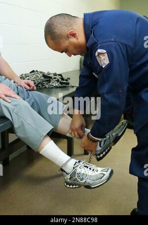 Corrections Officer in handcuffs Stock Photo - Alamy