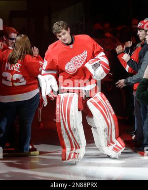 Detroit Red Wings goalie Thomas Greiss, left, stops a shot by Columbus ...